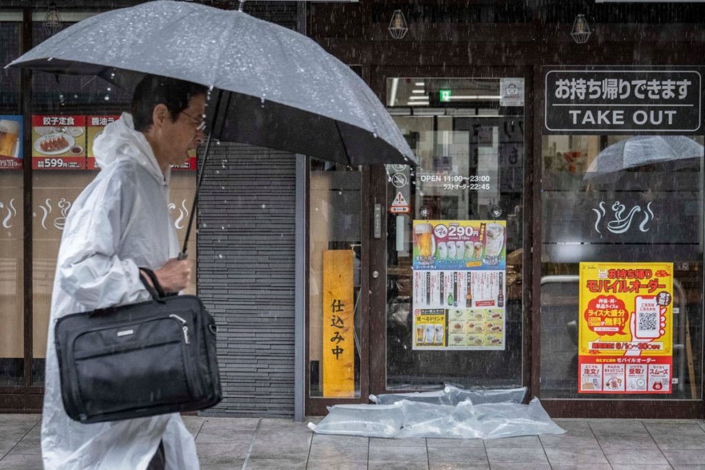 Typhoon Jangmi slams into Japan triggering top-level flood warnings and ...